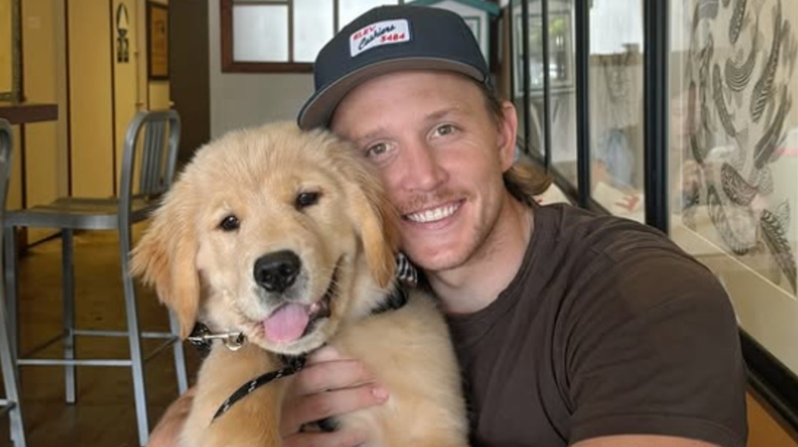 Golden Retriever Still Getting Carried Around Like A Baby By His Dad Is ...